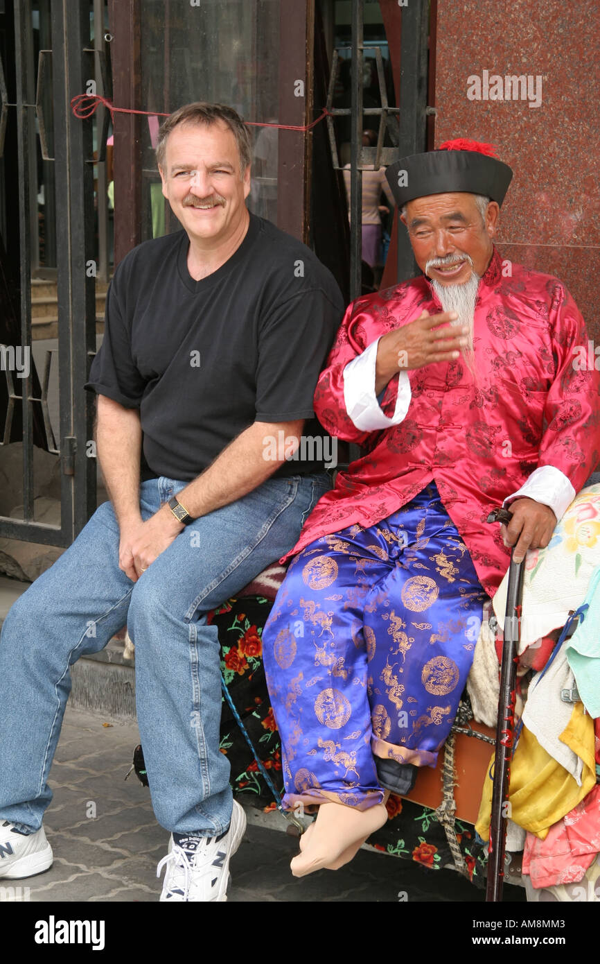 American with Chinese man in traditional clothing View of the Old Town ...