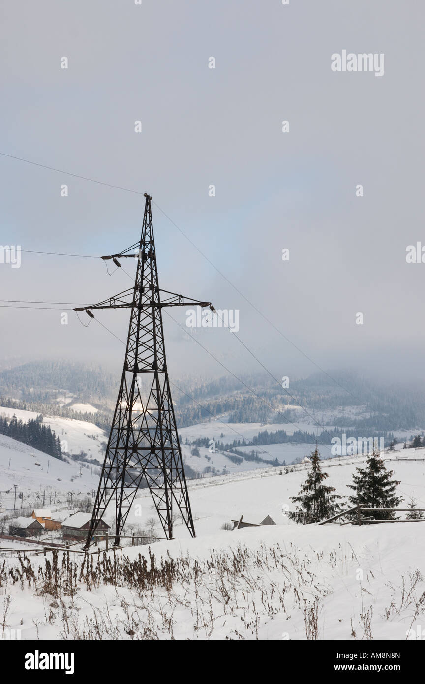 winter mountain landscape with high voltage current line Stock Photo ...