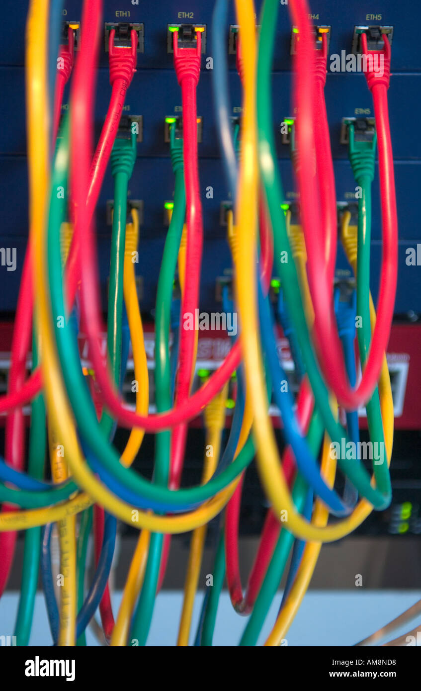 colored cables connected to ethernet hubs Stock Photo - Alamy