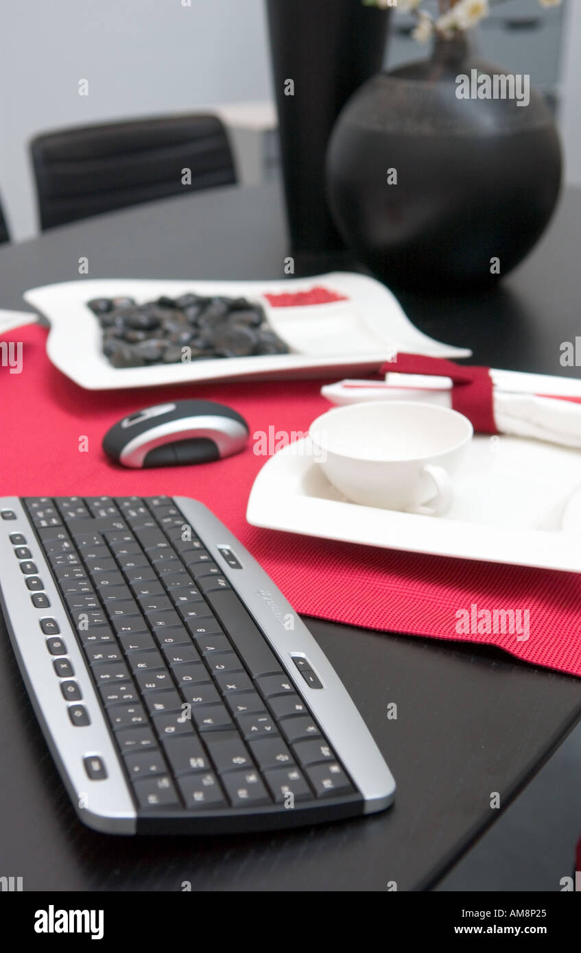 wireless keyboard and mouse on dinner table Stock Photo - Alamy