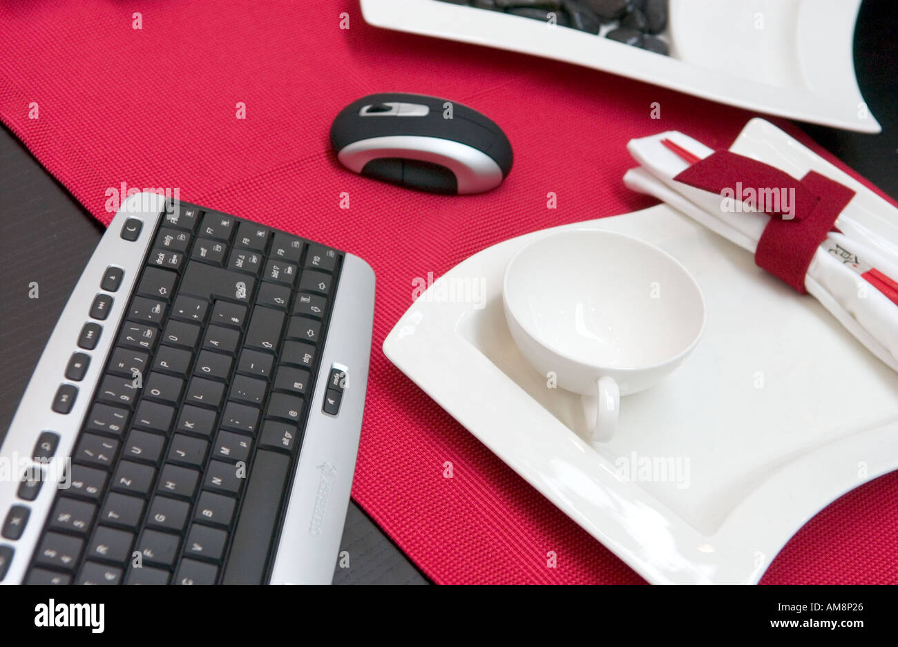 wireless keyboard and mouse on dinner table Stock Photo - Alamy