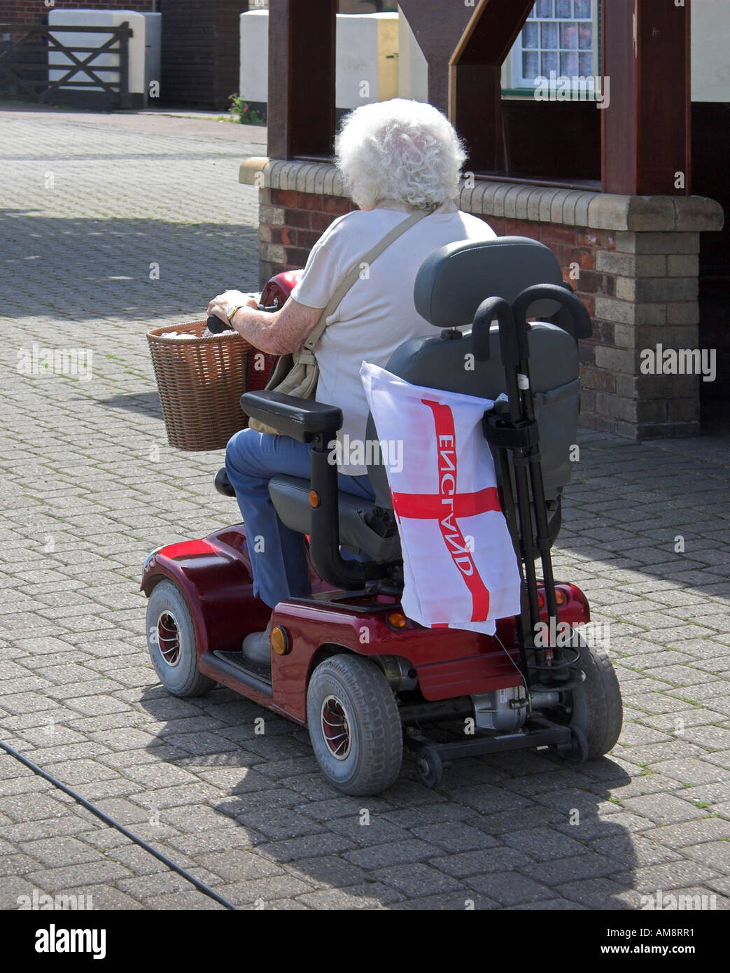 Old lady riding mobility scooter hi-res stock photography and images ...