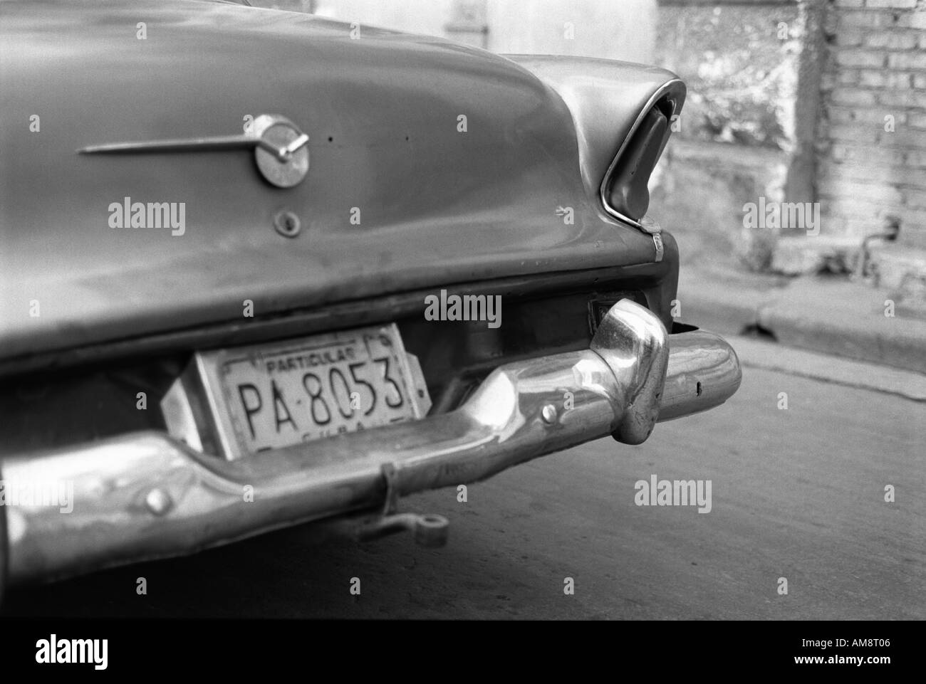Old battered 50 s Cadillac car rear view Scene in a street in old ...