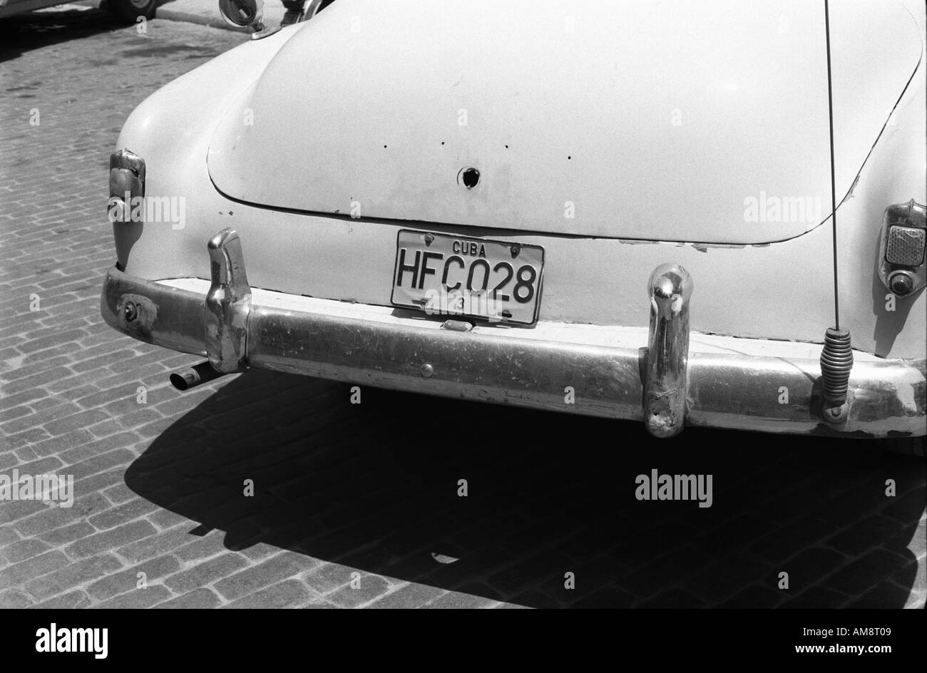 Old 50 s white Chevrolet car rear view Scene in a street in old Havanna ...
