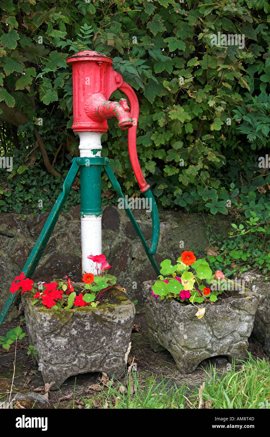 Brightly painted old village pump at Rhydyronen in Snowdonia Stock ...