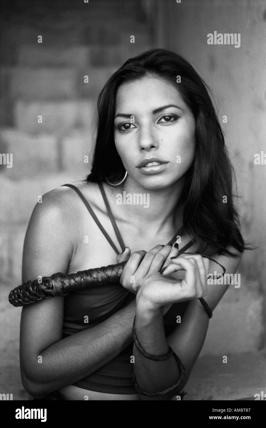 Sexy Cuban Dark Haired Girl Facing You She Is Sitting On The Stairs Of