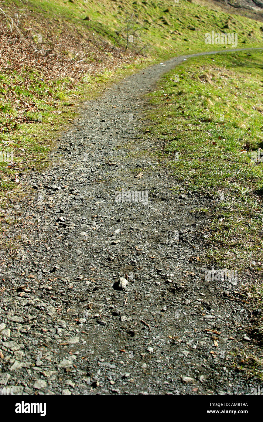 Gravel footpath winding into distance Stock Photo - Alamy