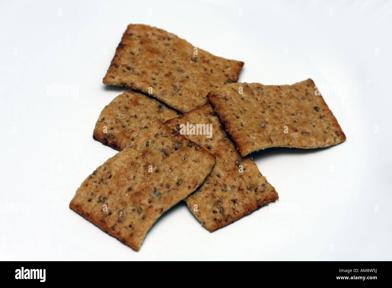 Five crackers on a white plate Stock Photo - Alamy