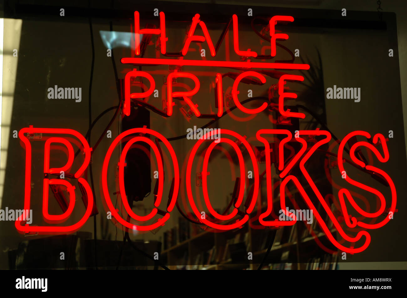 Illuminated neon sign in the window of a used bookstore Stock Photo - Alamy