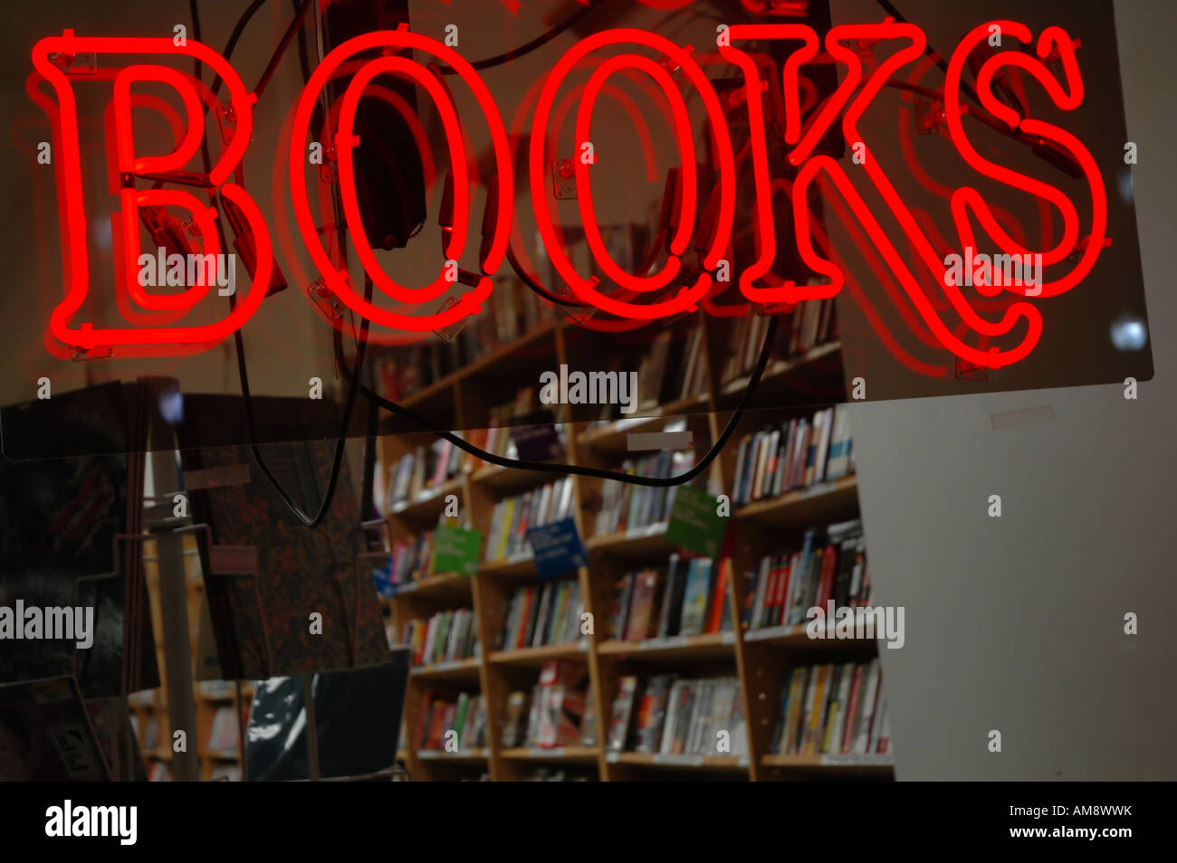 Illuminated neon sign in the window of a used bookstore Stock Photo - Alamy