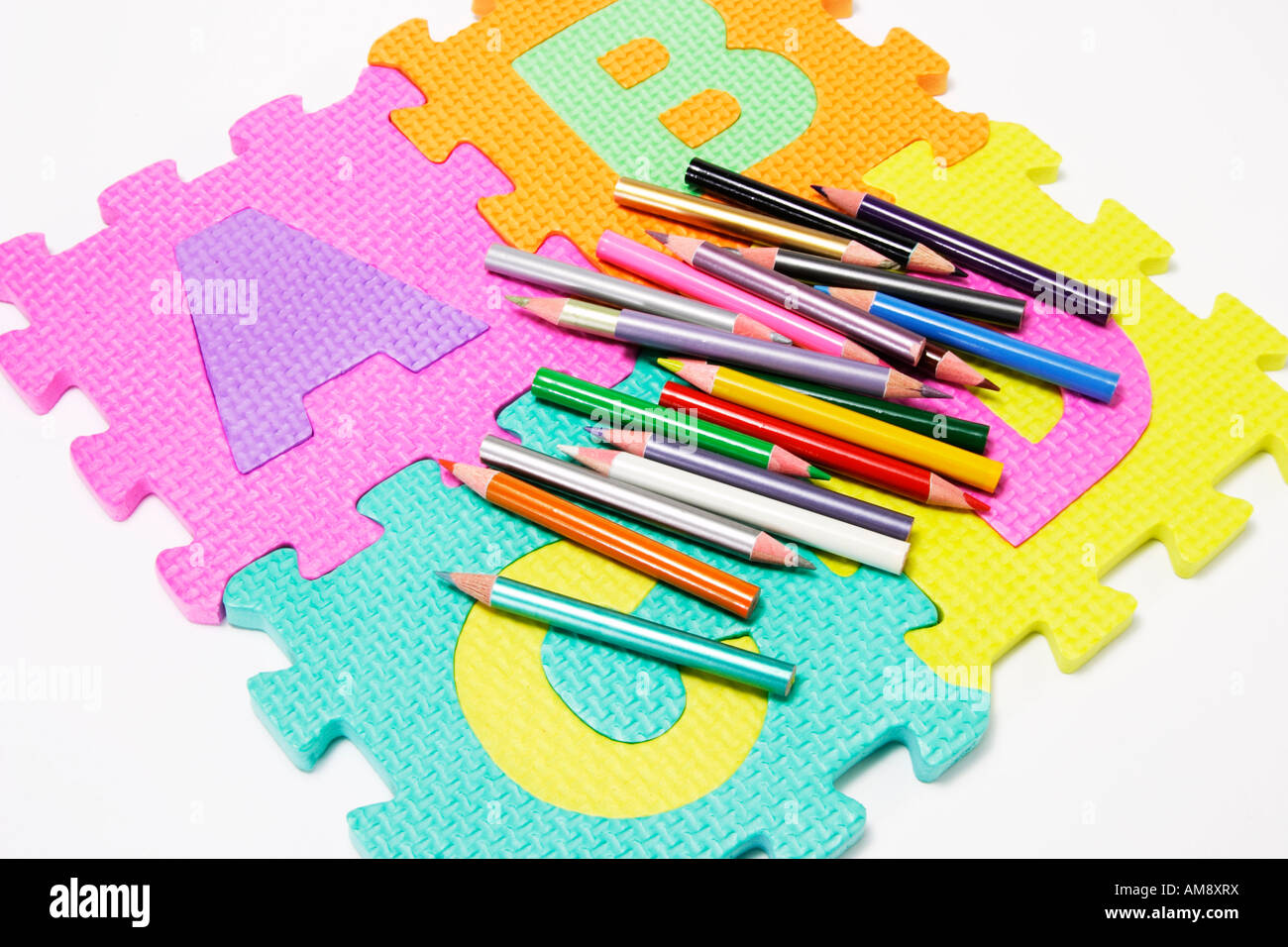 Colour Pencils and Alphabets Stock Photo - Alamy