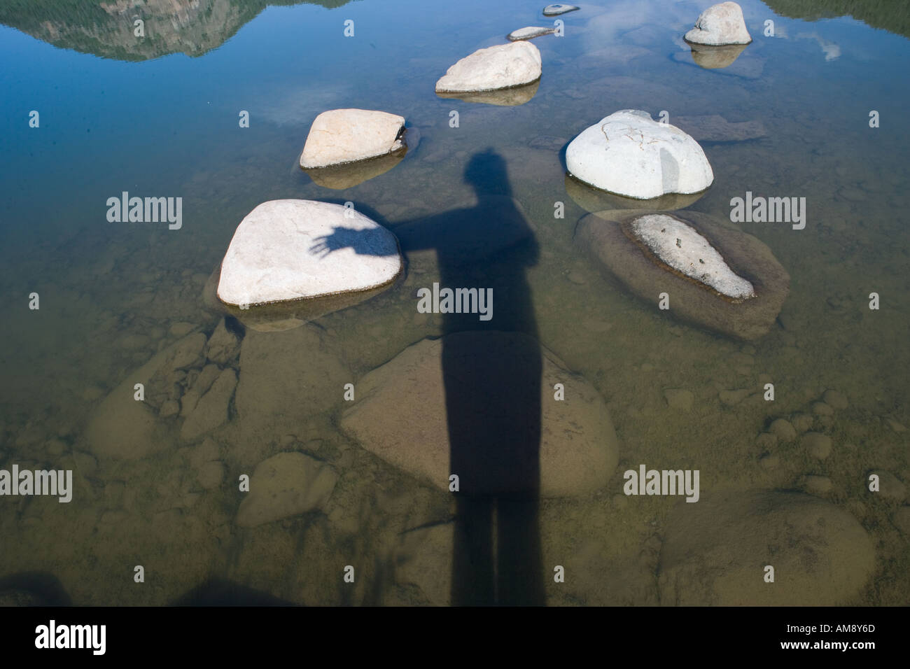 shadow with hand on rock Stock Photo - Alamy
