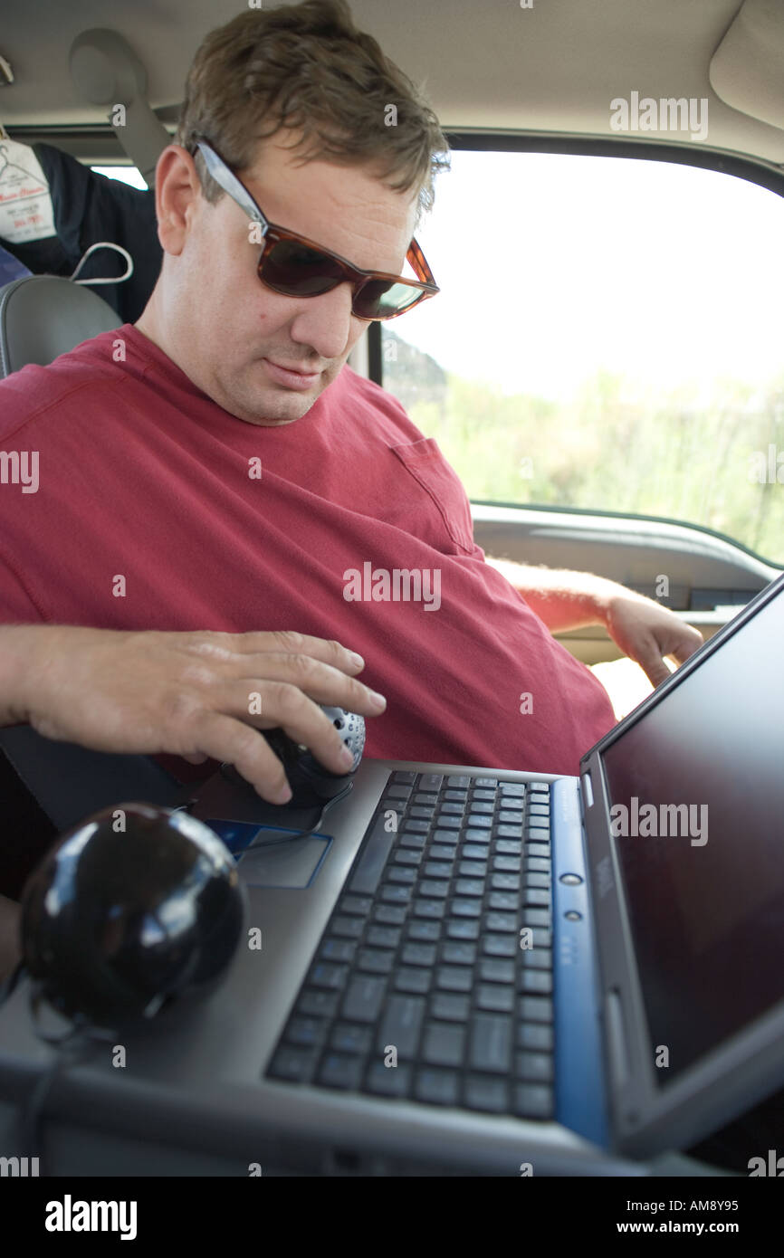 man using lap top computer in car Stock Photo - Alamy