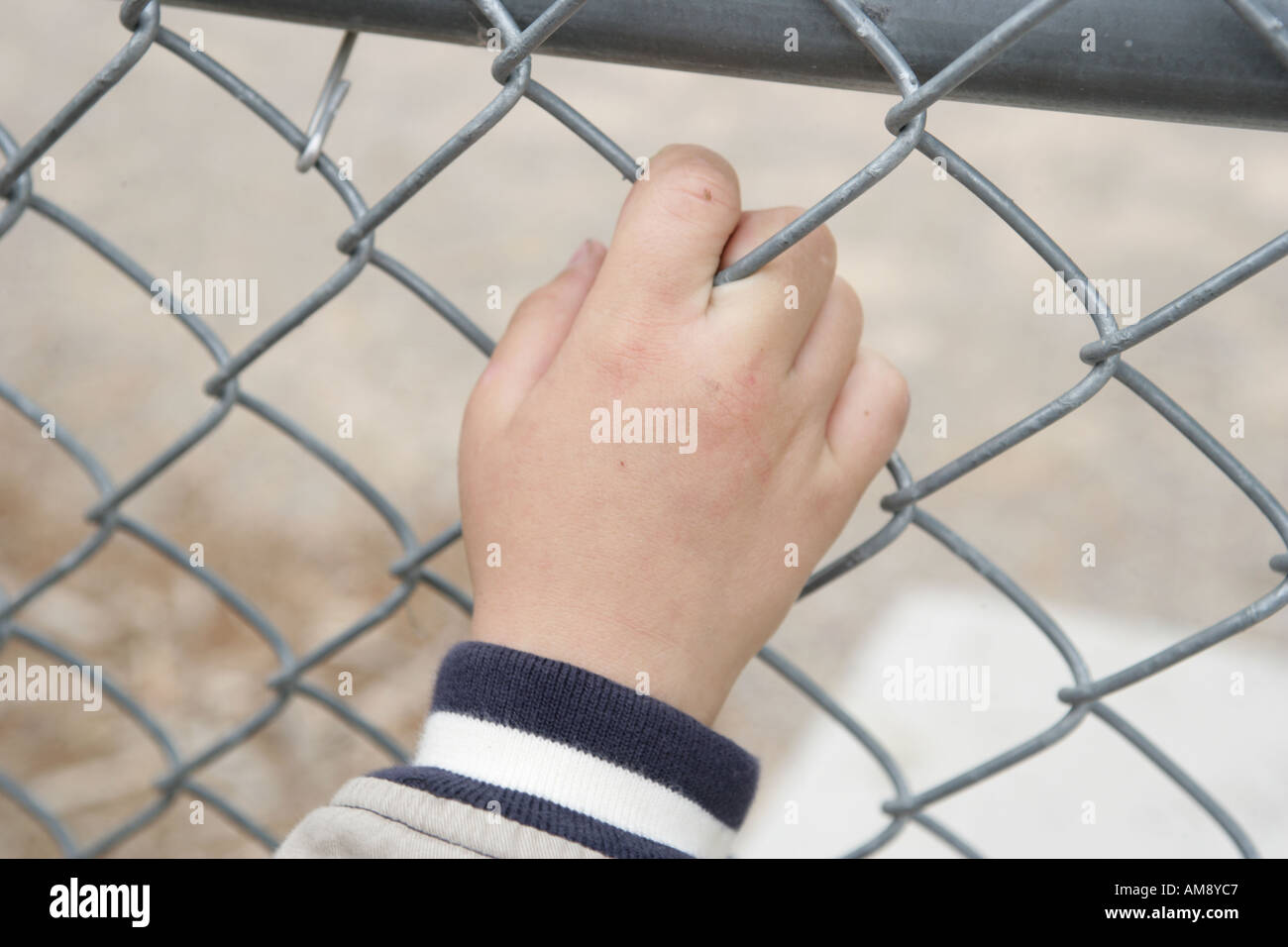 childs hand on fence Stock Photo - Alamy