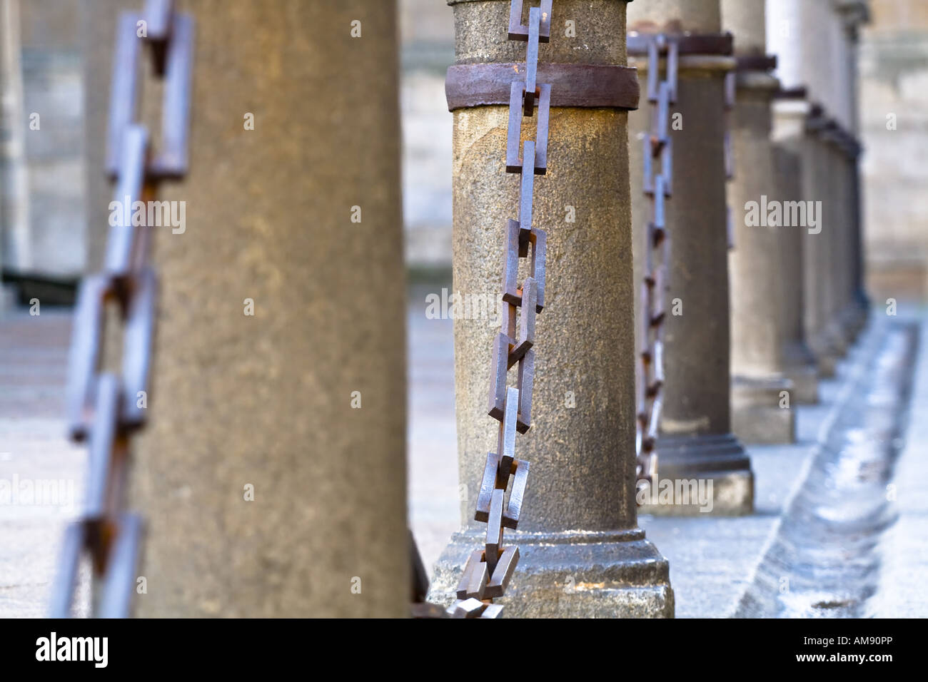 Columns united by chains Stock Photo - Alamy