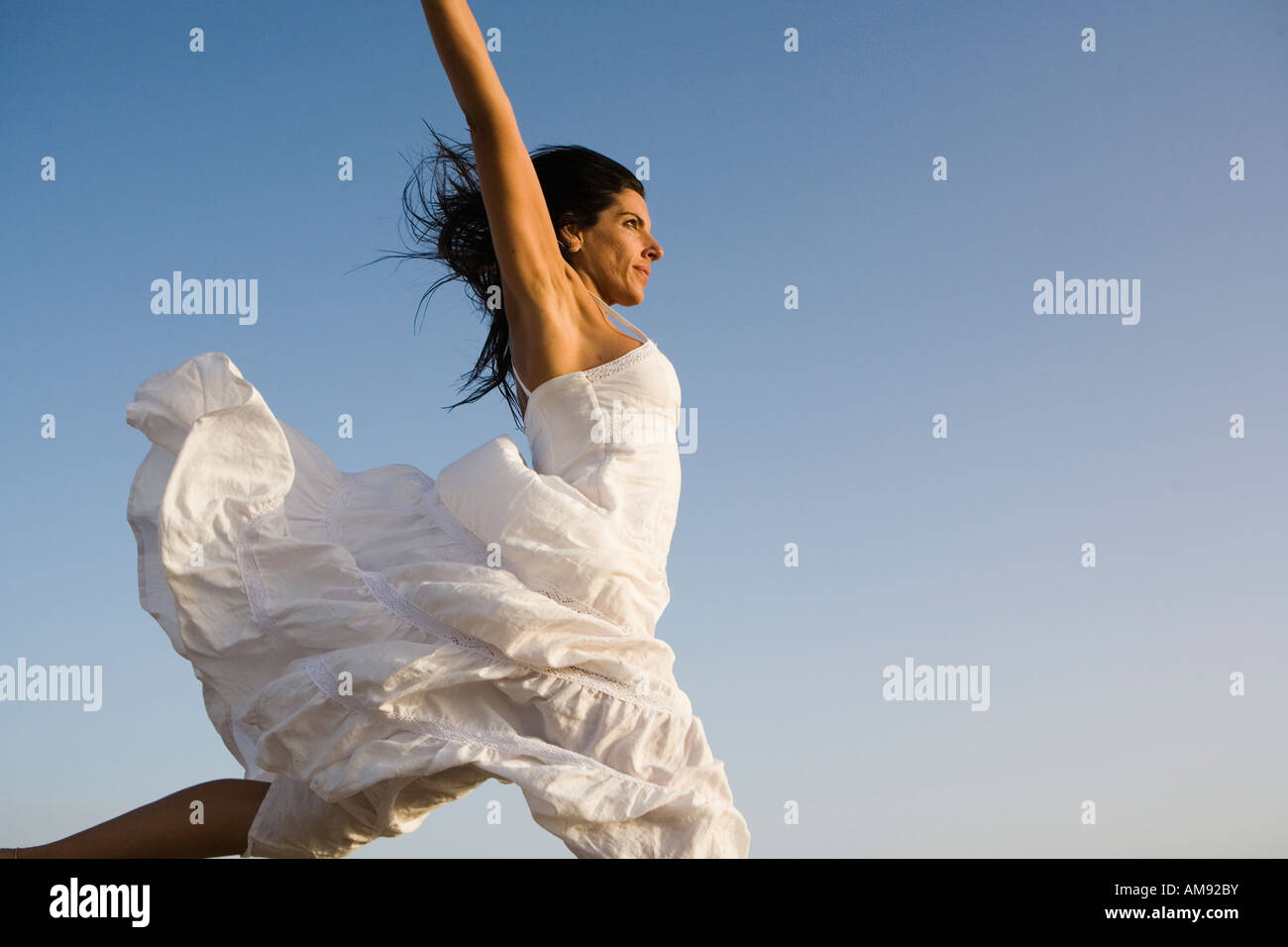 Woman Jumping In Dress