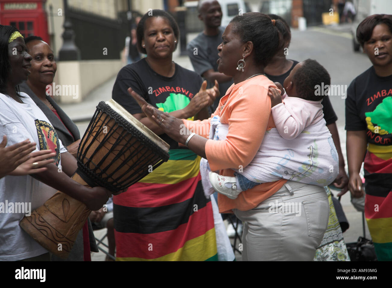 Women drumming,singing and dancing Zimbabwe anti Mugabe democracy vigil ...
