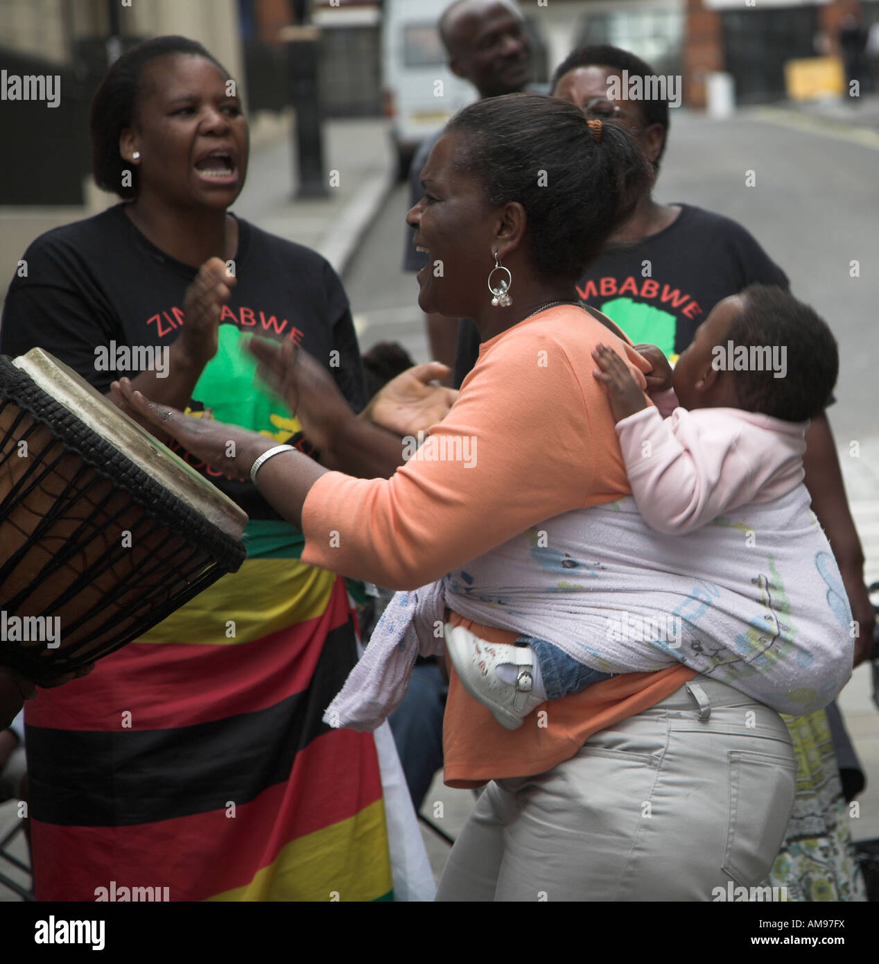 Women drumming,singing and dancing Zimbabwe anti Mugabe democracy vigil ...