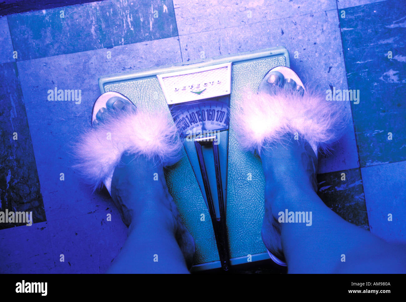 Woman standing on personal scales hi-res stock photography and images ...