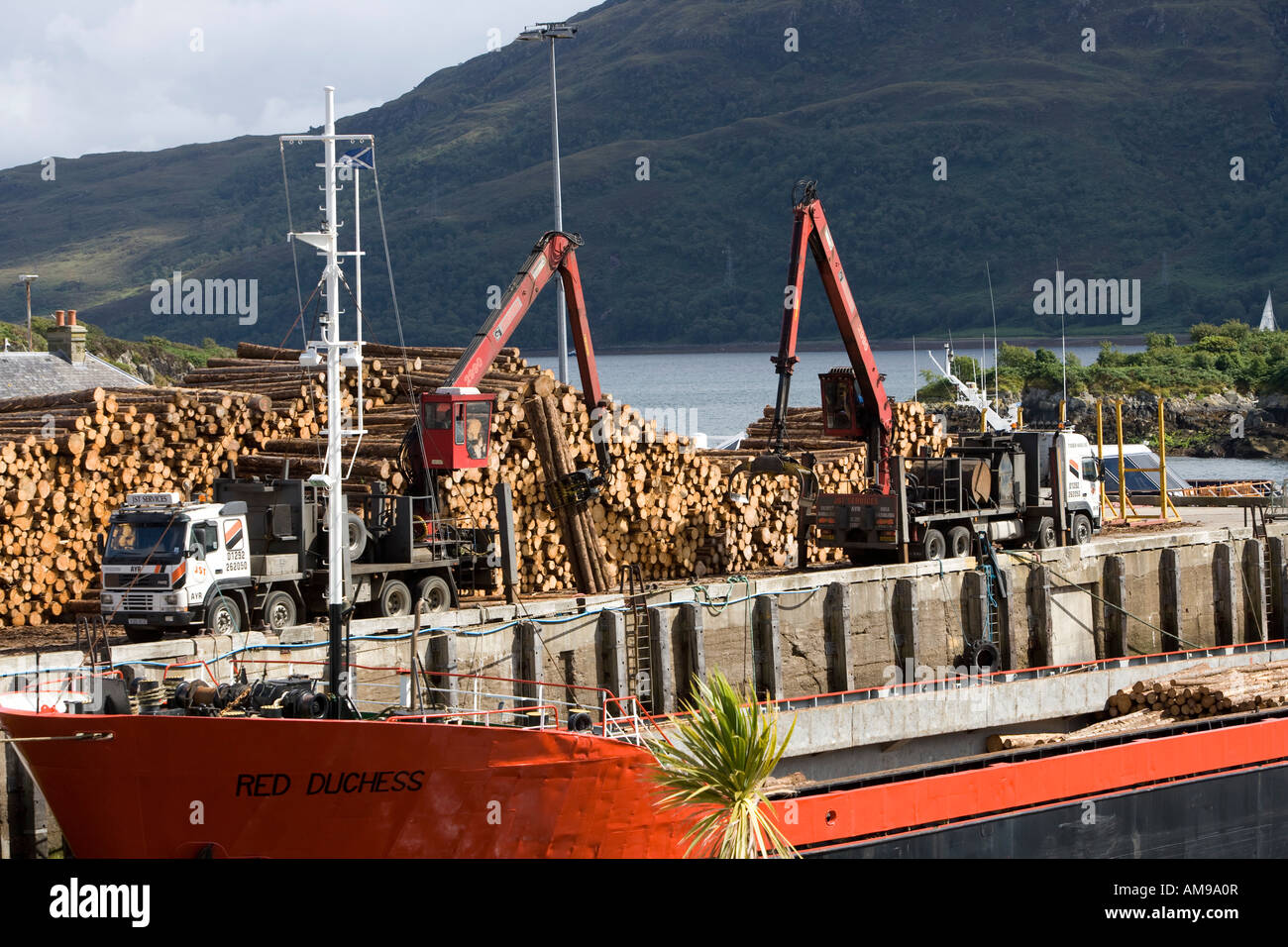 Cargo Ship Being Loaded With Timber, Kyle of Lochalsh, Scotland, UK ...