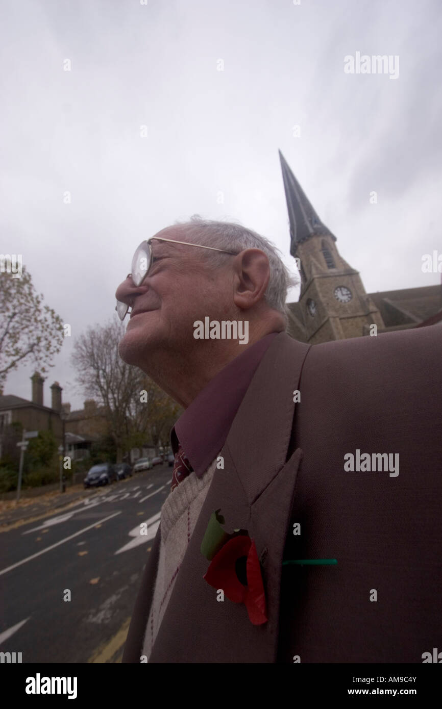 oap elderly gentleman with poppy and church in background Southend UK ...