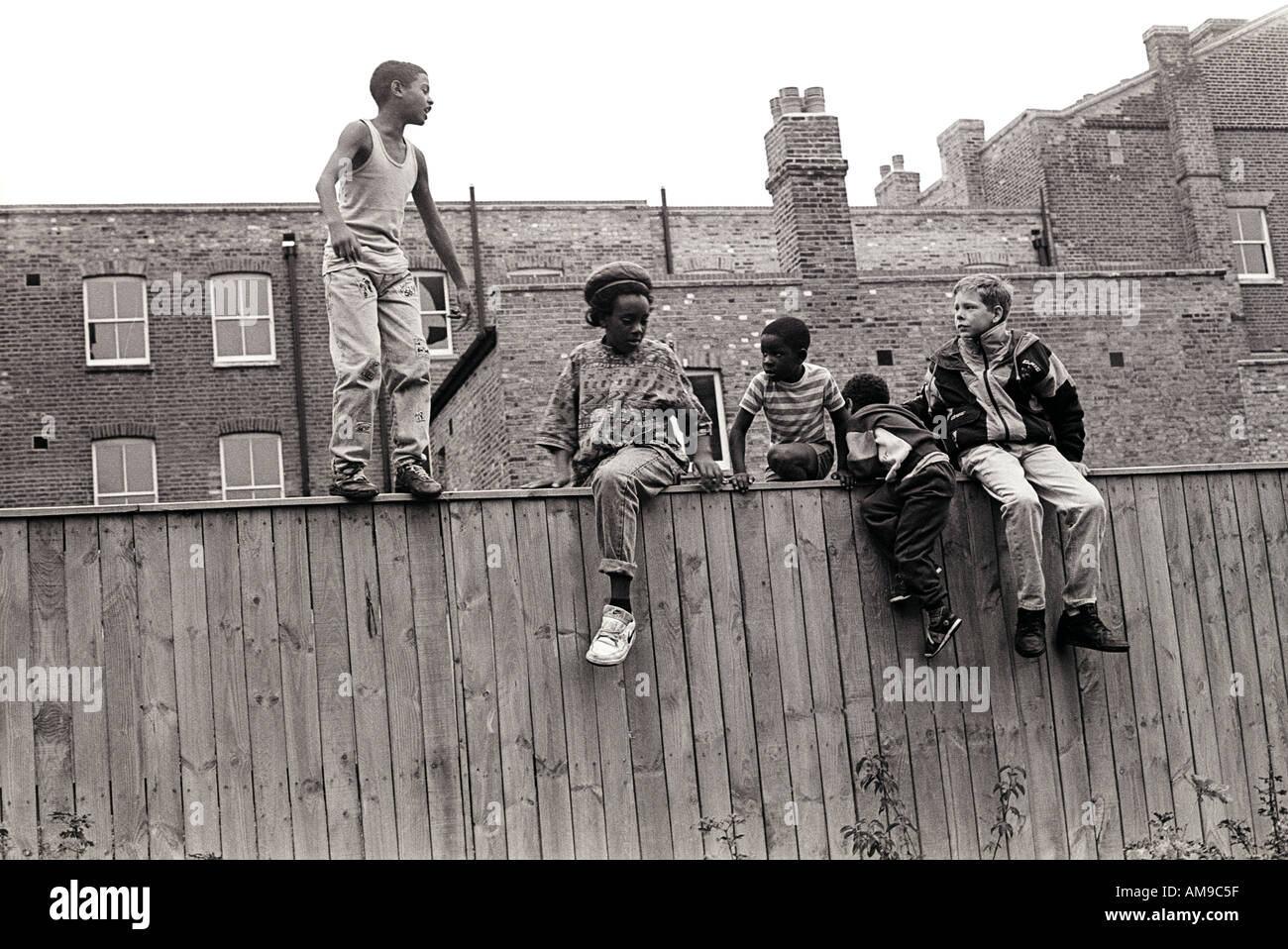 Person climbing over fence hi-res stock photography and images - Alamy