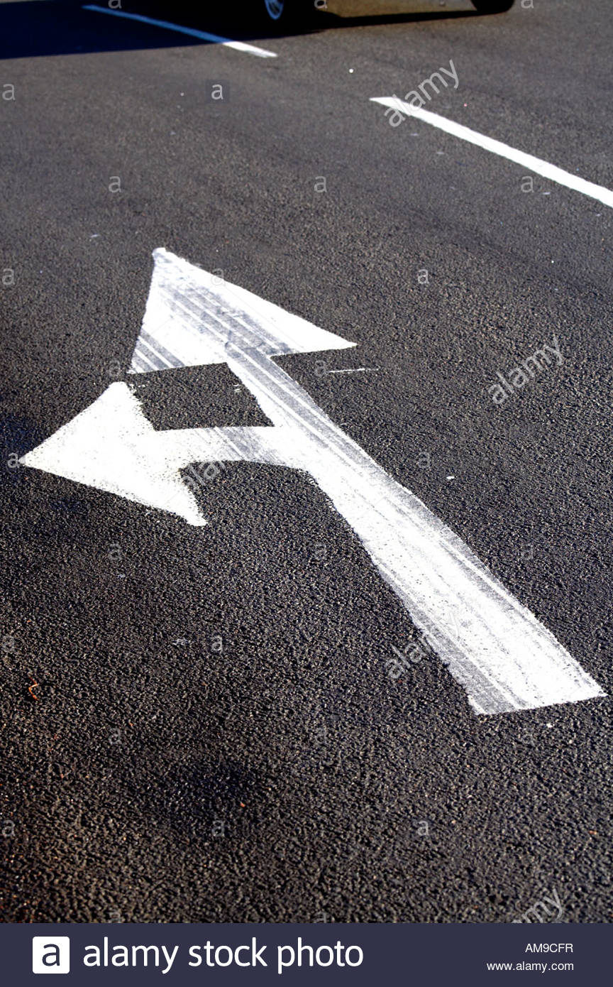 Ahead and left road markings approaching a junction Stock Photo - Alamy