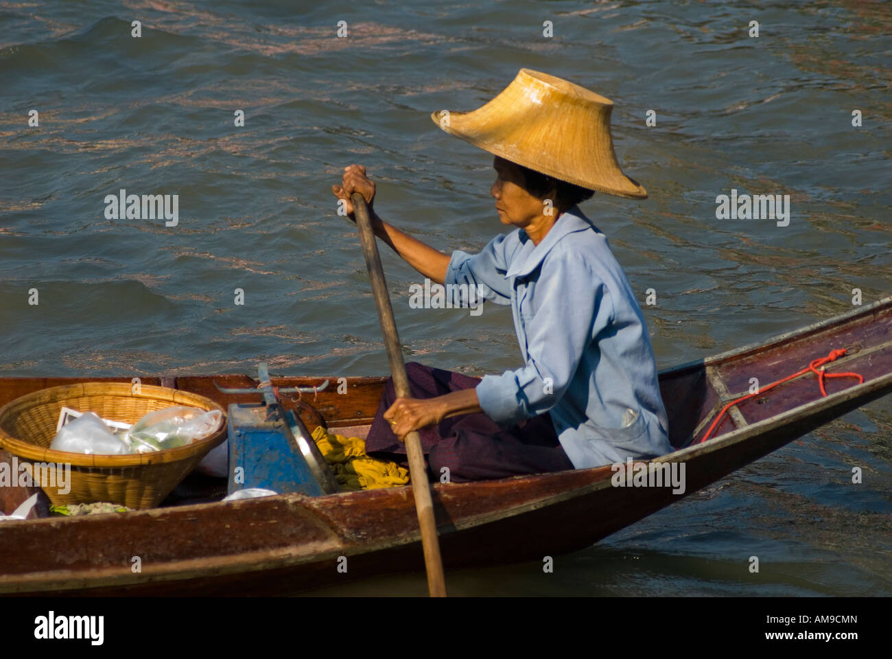 Local trader at floating market Stock Photo - Alamy