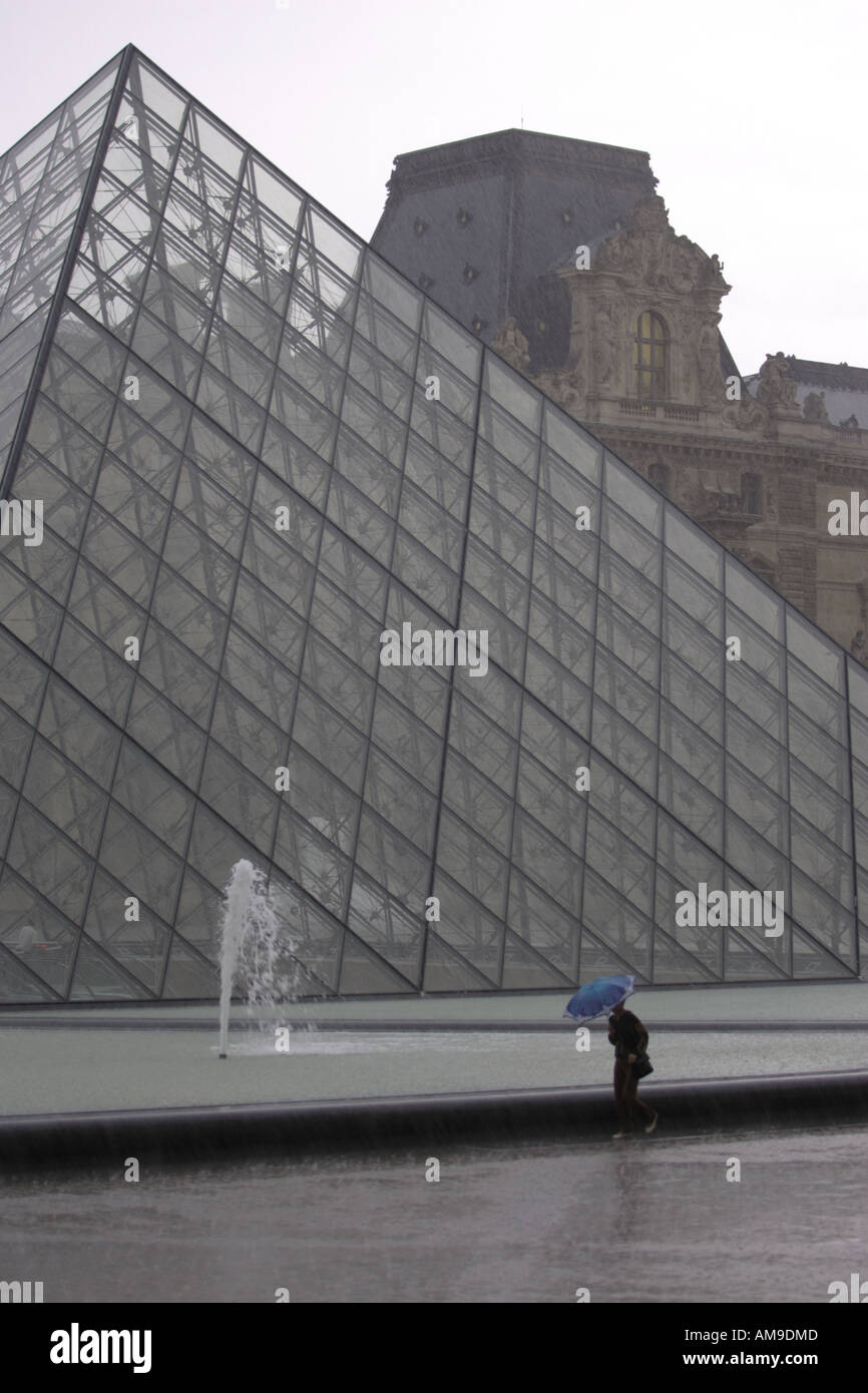 Louvre rain umbrella hi-res stock photography and images - Alamy