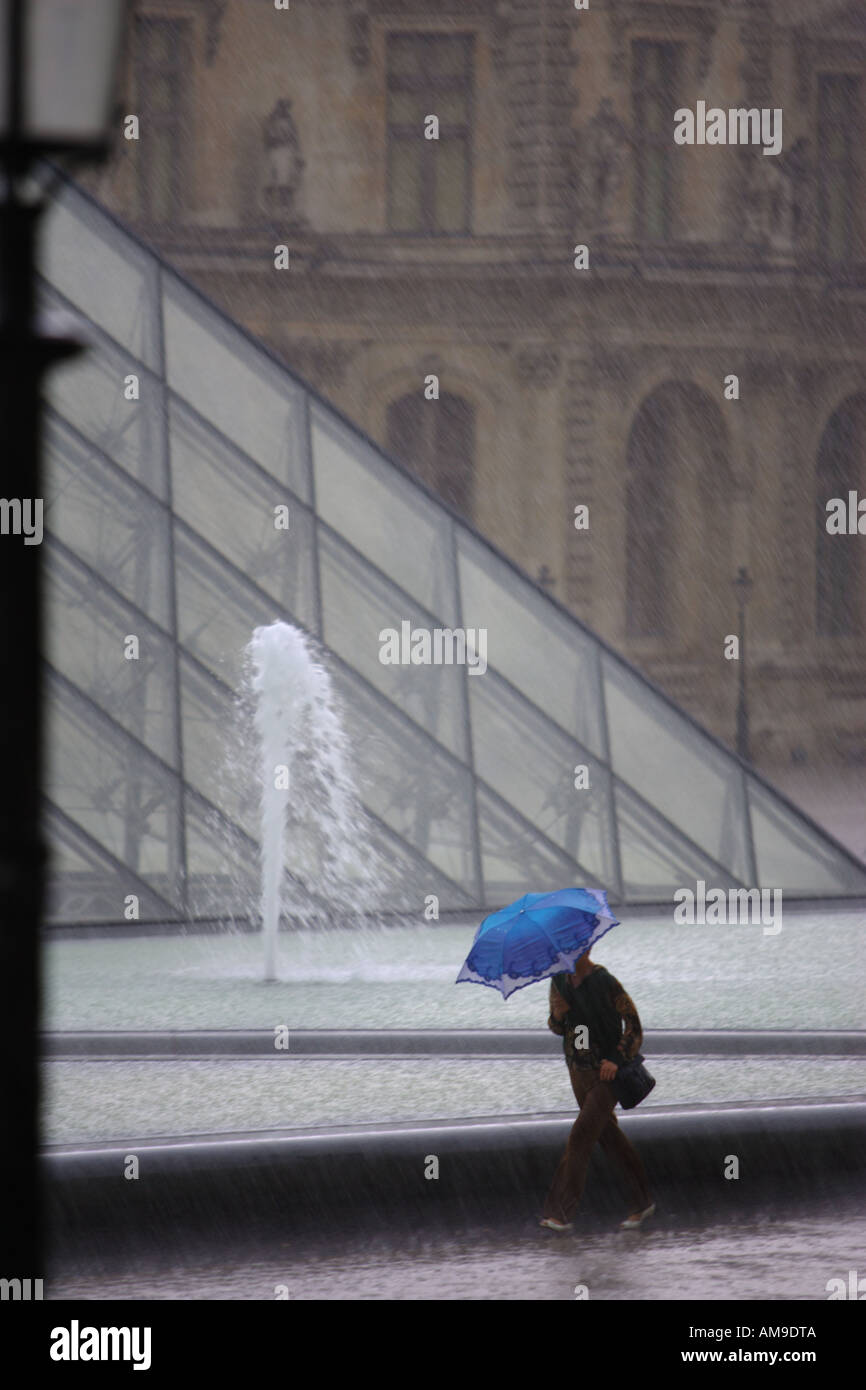 Louvre rain umbrella hi-res stock photography and images - Alamy