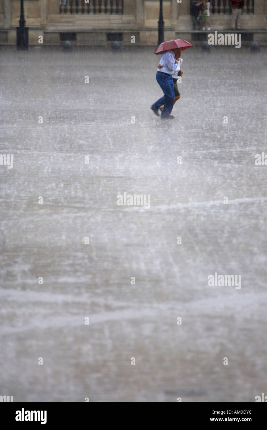 Louvre rain umbrella hi-res stock photography and images - Alamy