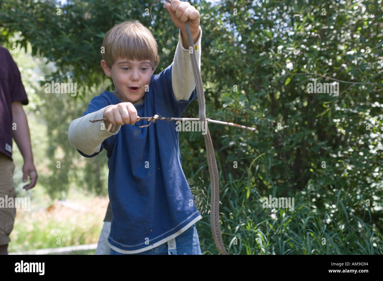 Boy with snake hi-res stock photography and images - Alamy