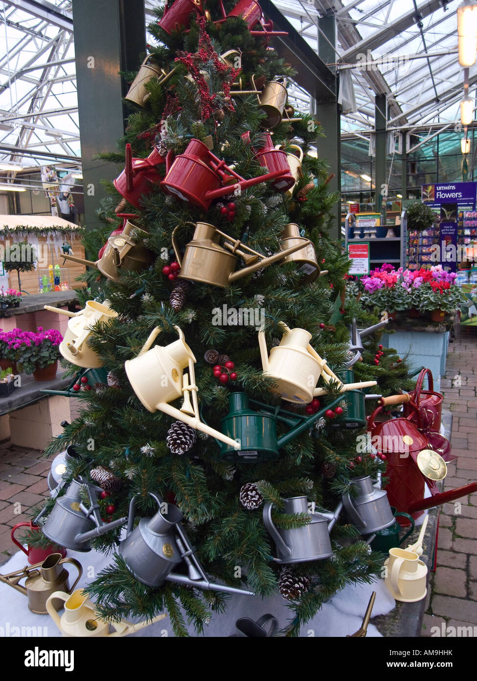 Unusual Christmas tree with colourful watering cans used as bauble ...
