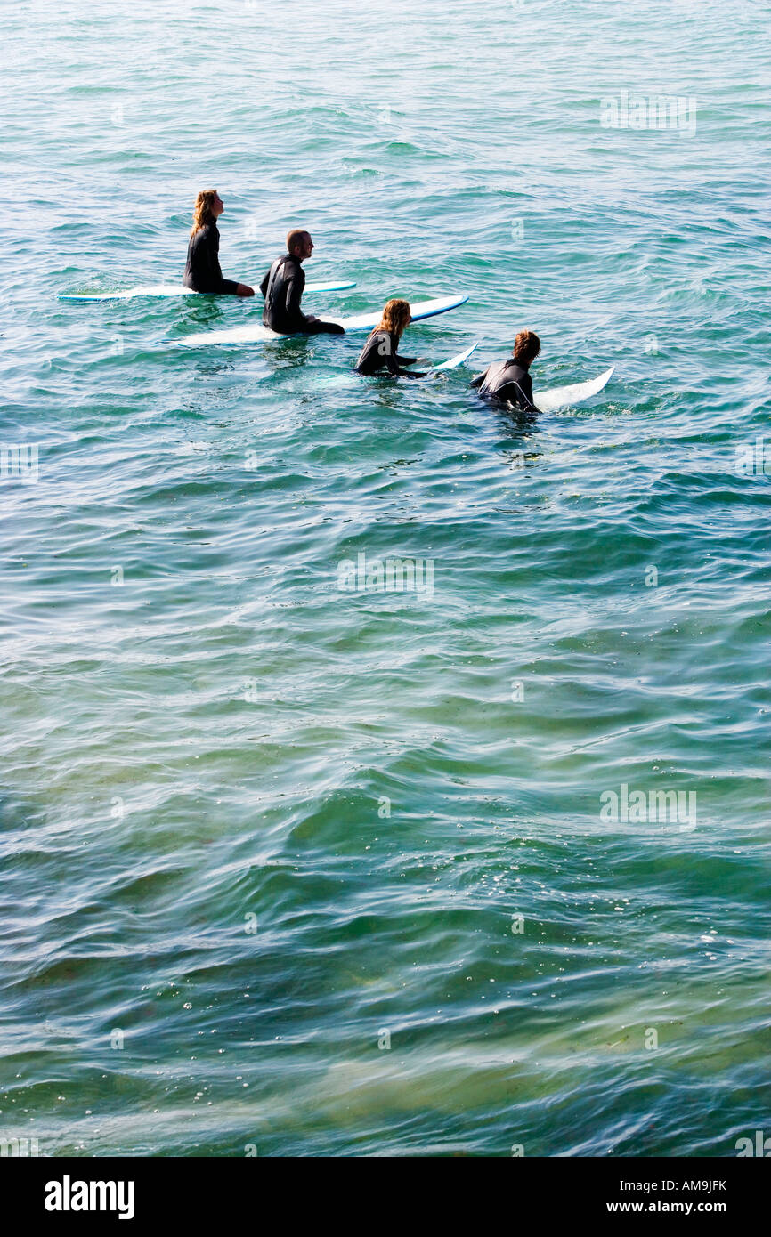 People Sitting On Surfboard