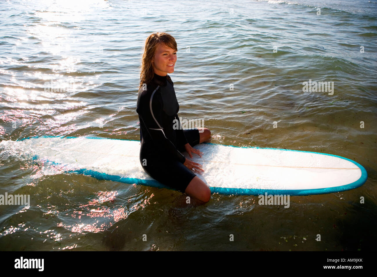 Sitting on a surfboard hi-res stock photography and images - Alamy