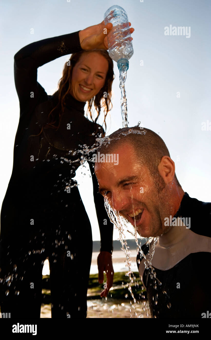 Woman pouring drink over man's head hi-res stock photography and images ...