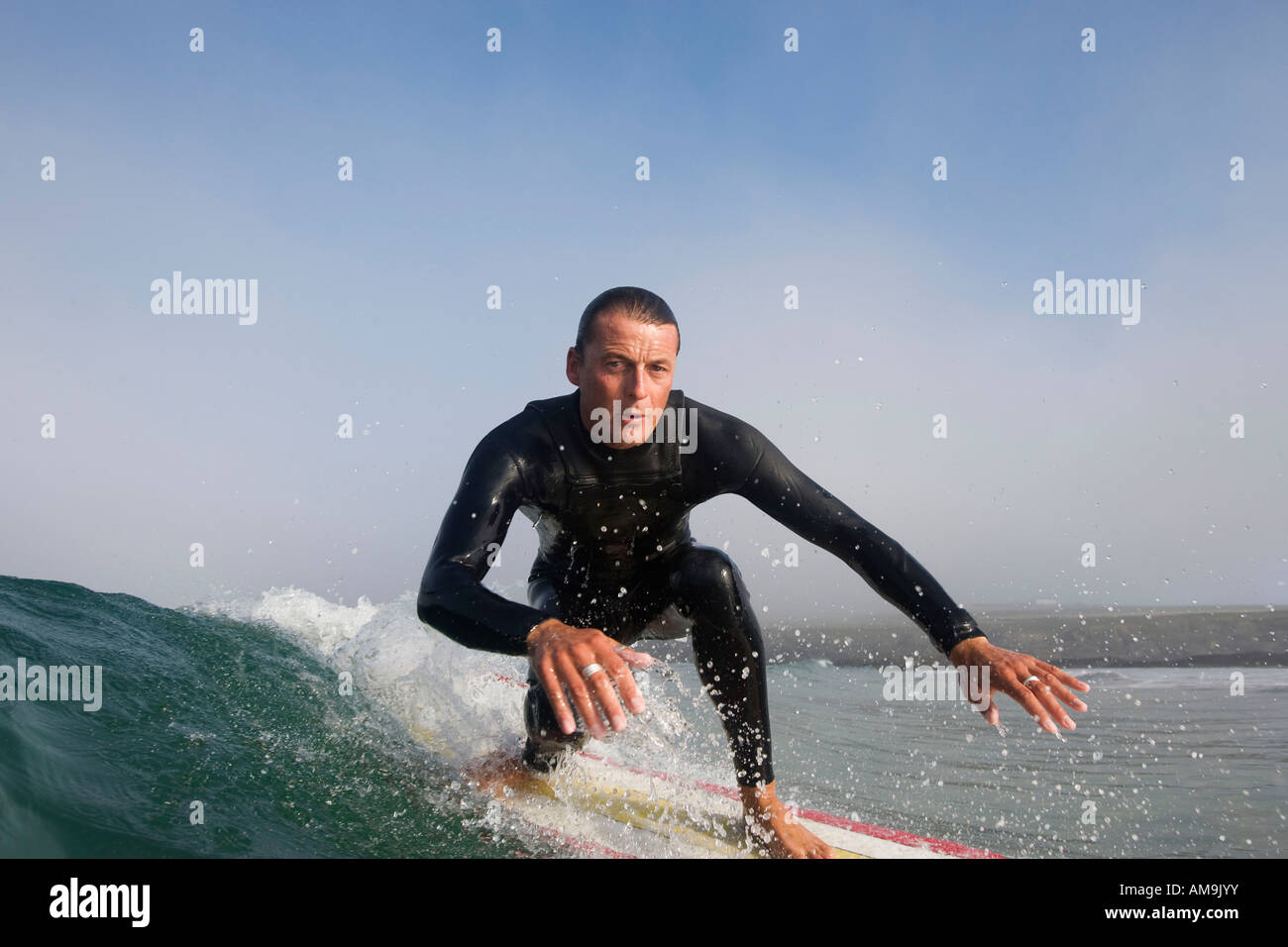 Man surfing a wave Stock Photo - Alamy