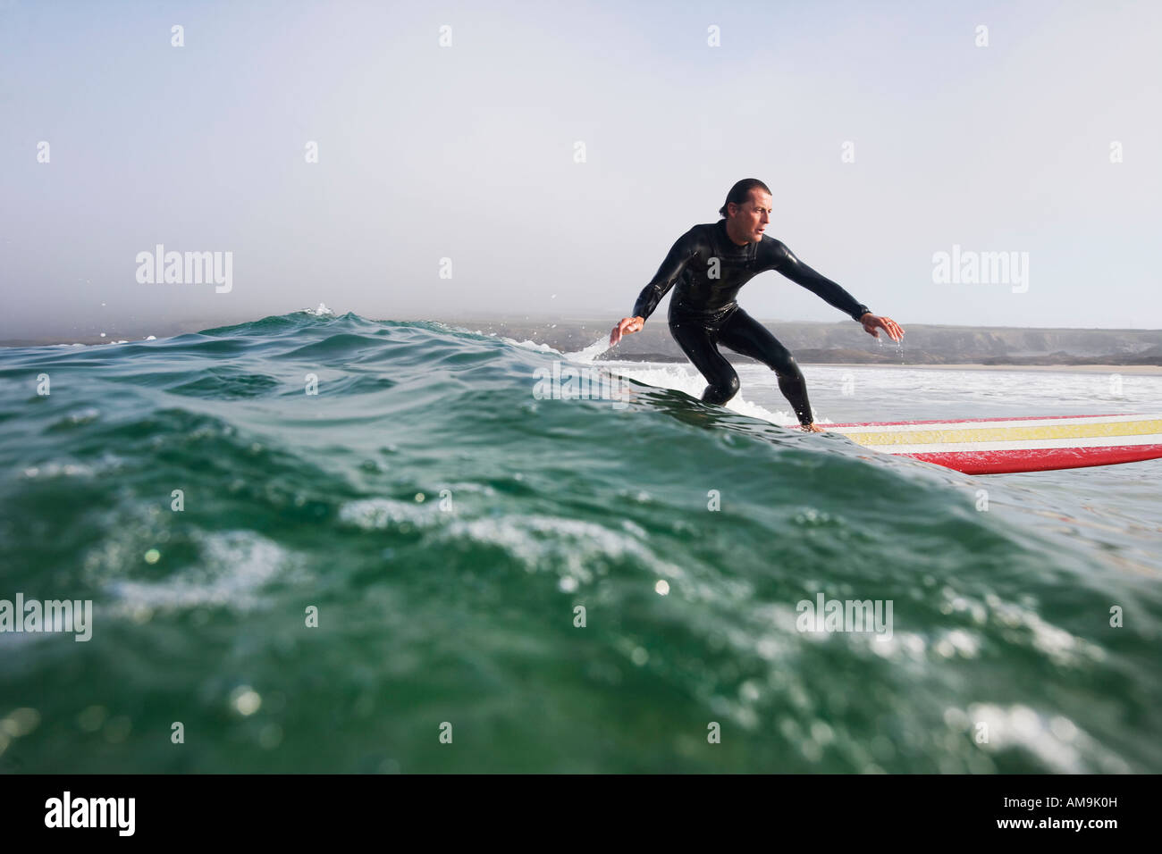 Man surfing a wave Stock Photo - Alamy