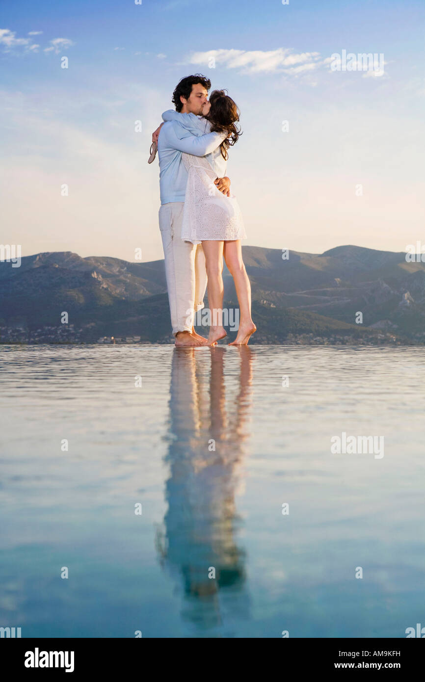 Couple Kissing At Swimming Pool High Resolution Stock Photography and ...
