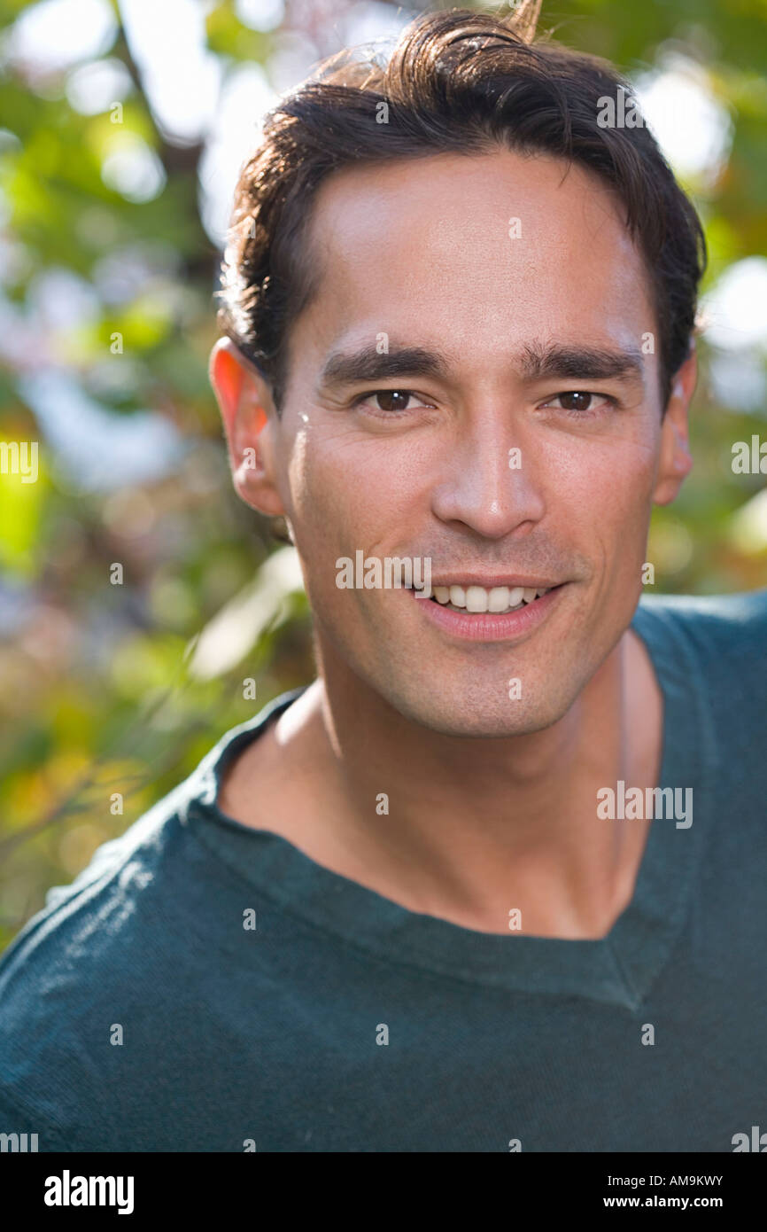 Man smiling outdoors looking at camera Stock Photo - Alamy