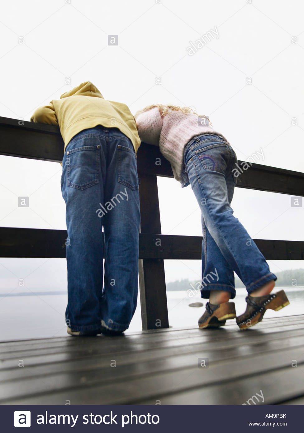 Leaning Over Rail Stock Photos & Leaning Over Rail Stock Images - Alamy