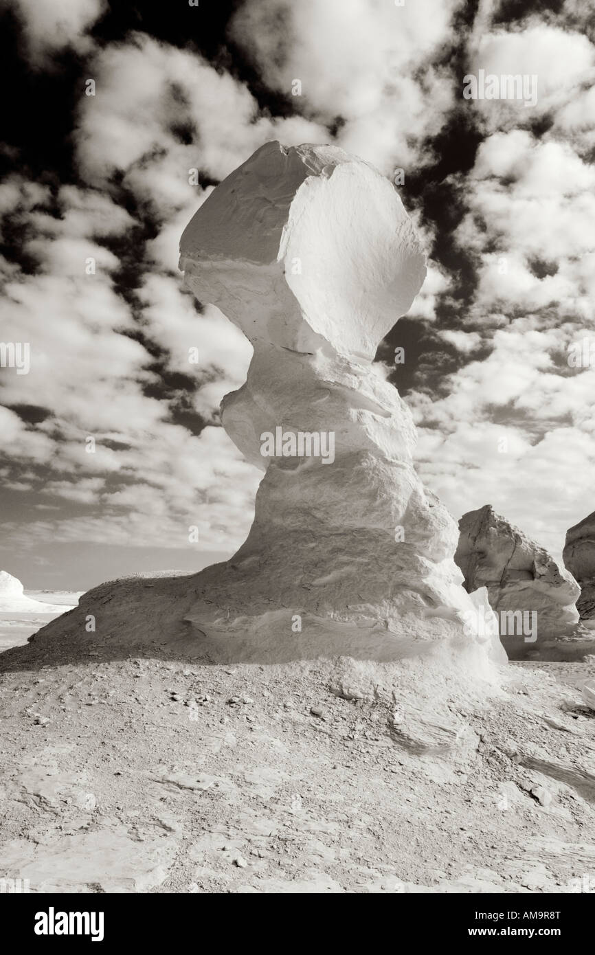 White limestone inselberg against brooding sky , White Desert , near ...