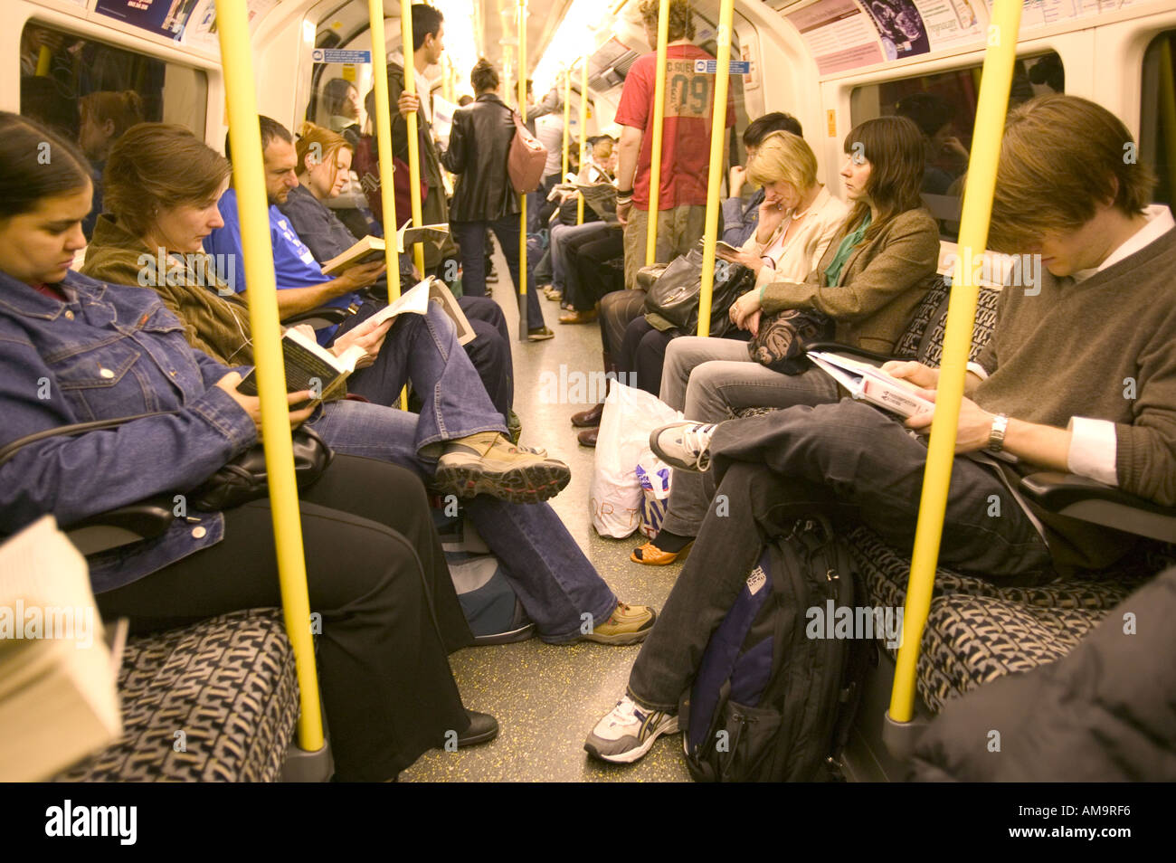 commuters and tourists on the london Underground Tube train Stock Photo ...