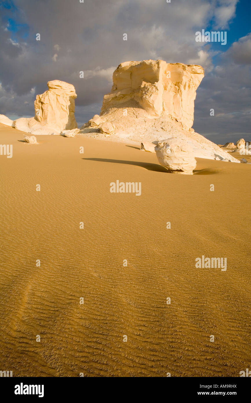 Inselbergs with surrounding ridged sand in the White Desert, near ...