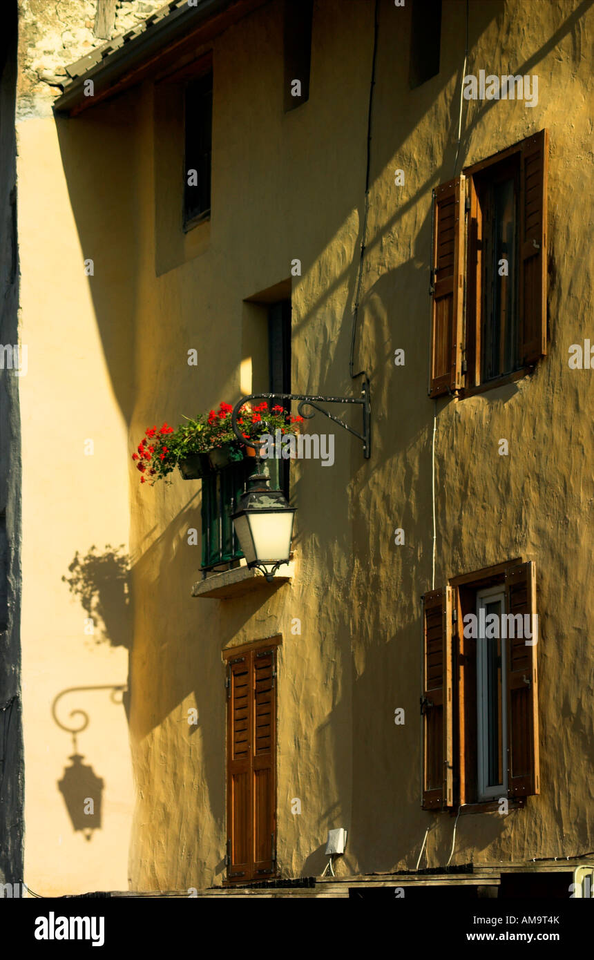Long evening shadows on old houses in the lovely French town of ...