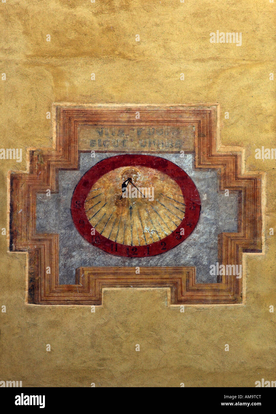 The sundial at on the Collegiale Notre Dame church in the lovely French ...