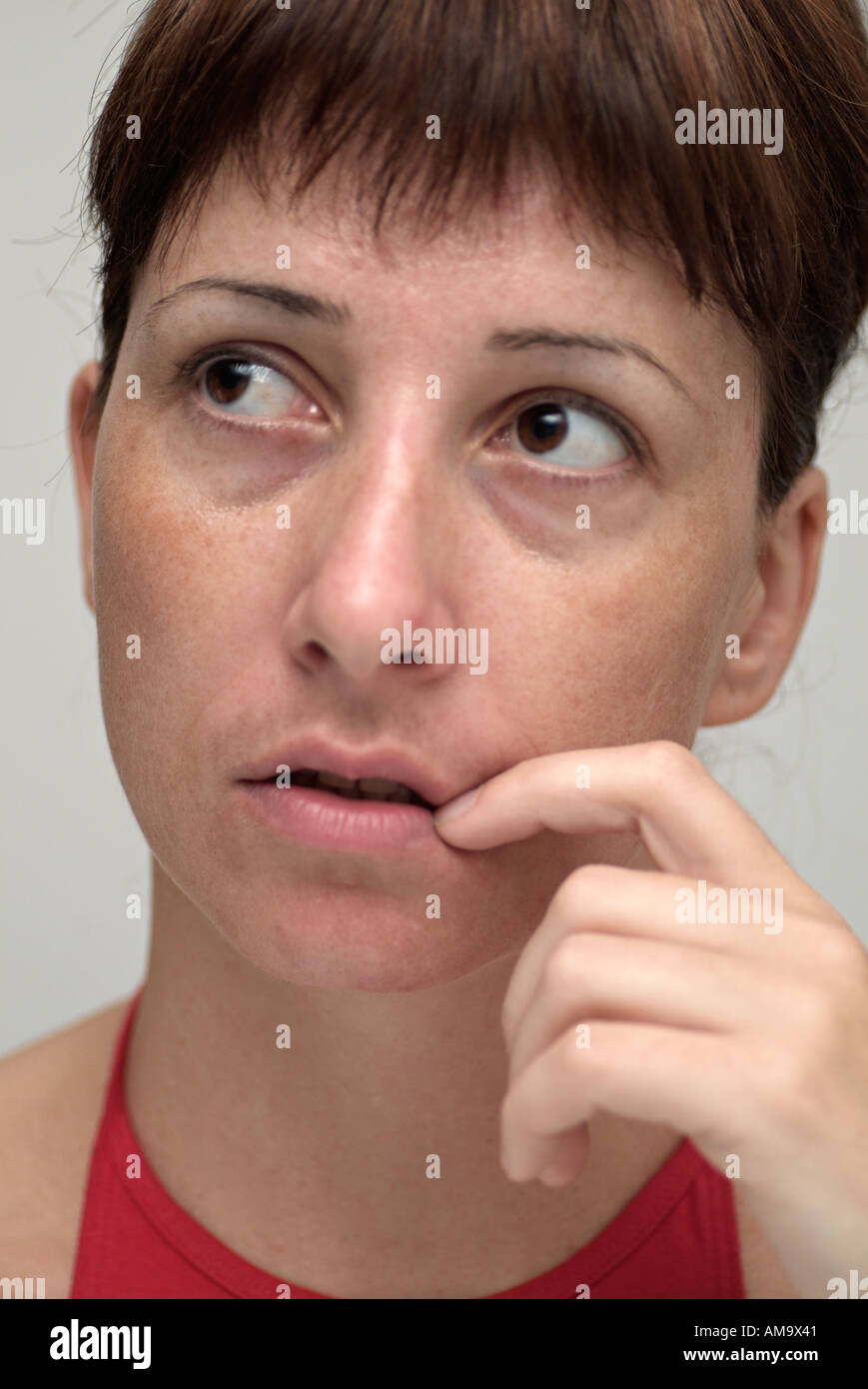 Face of a Young Woman in Deep Thought Stock Photo - Alamy