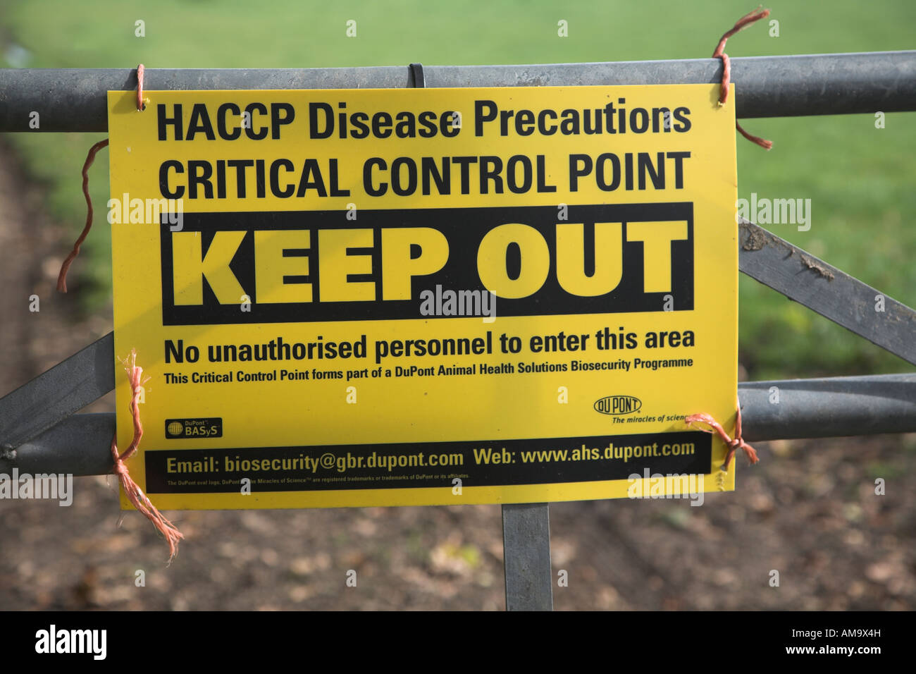 Yellow Keep Out sign on gate Critical Control Point HACCP disease ...