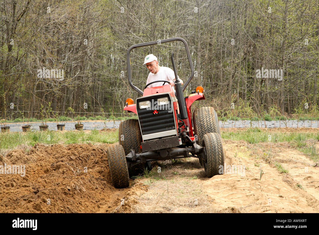 Man on plow preparing field hi-res stock photography and images - Alamy