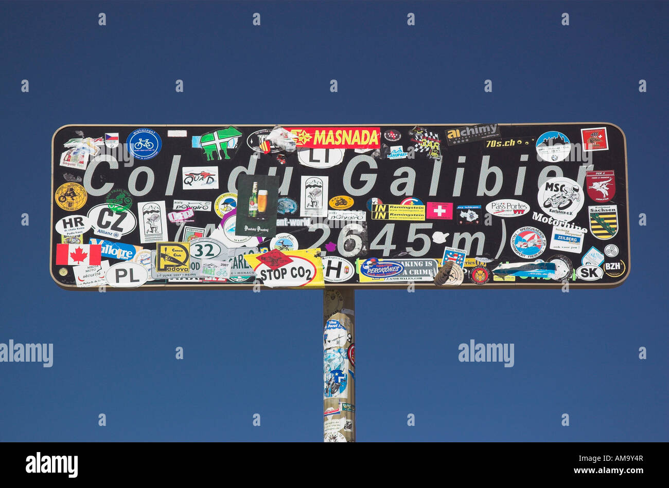 The sign for Col du Galibier covered in stickers Stock Photo - Alamy